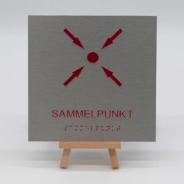 Braille-Schild Sammelpunkt mit Piktogramm